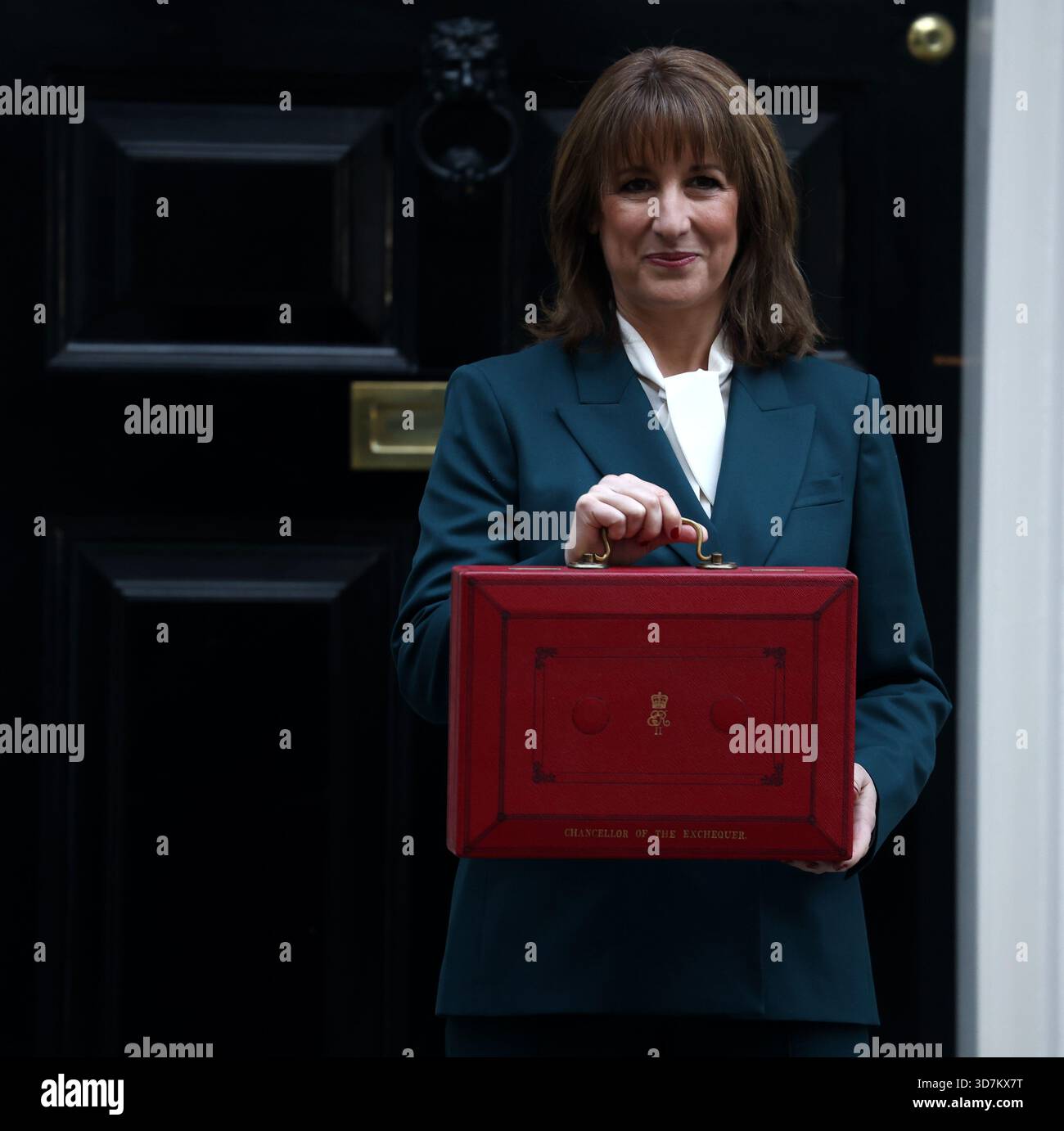 Chancellor of the Exchequer, Rachel Reeves, poses with the red Budget ...