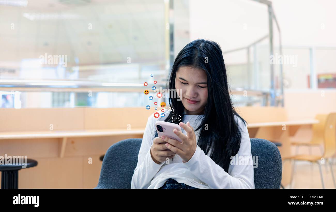 Teen girl using smartphone with social media reaction icons, chatting ...