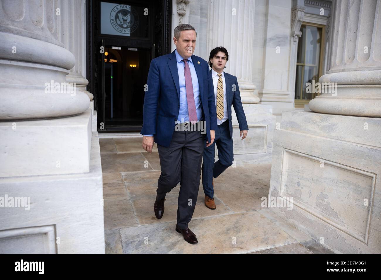 Rep. Jeff Hurd (R-Colo.) walks with an aide as he departs a vote the U ...