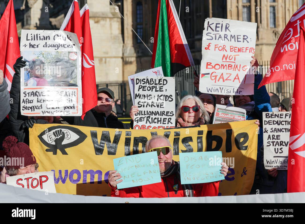 London. UK. 26 Nov 2025. Members of the Unite Union hold signs during a ...