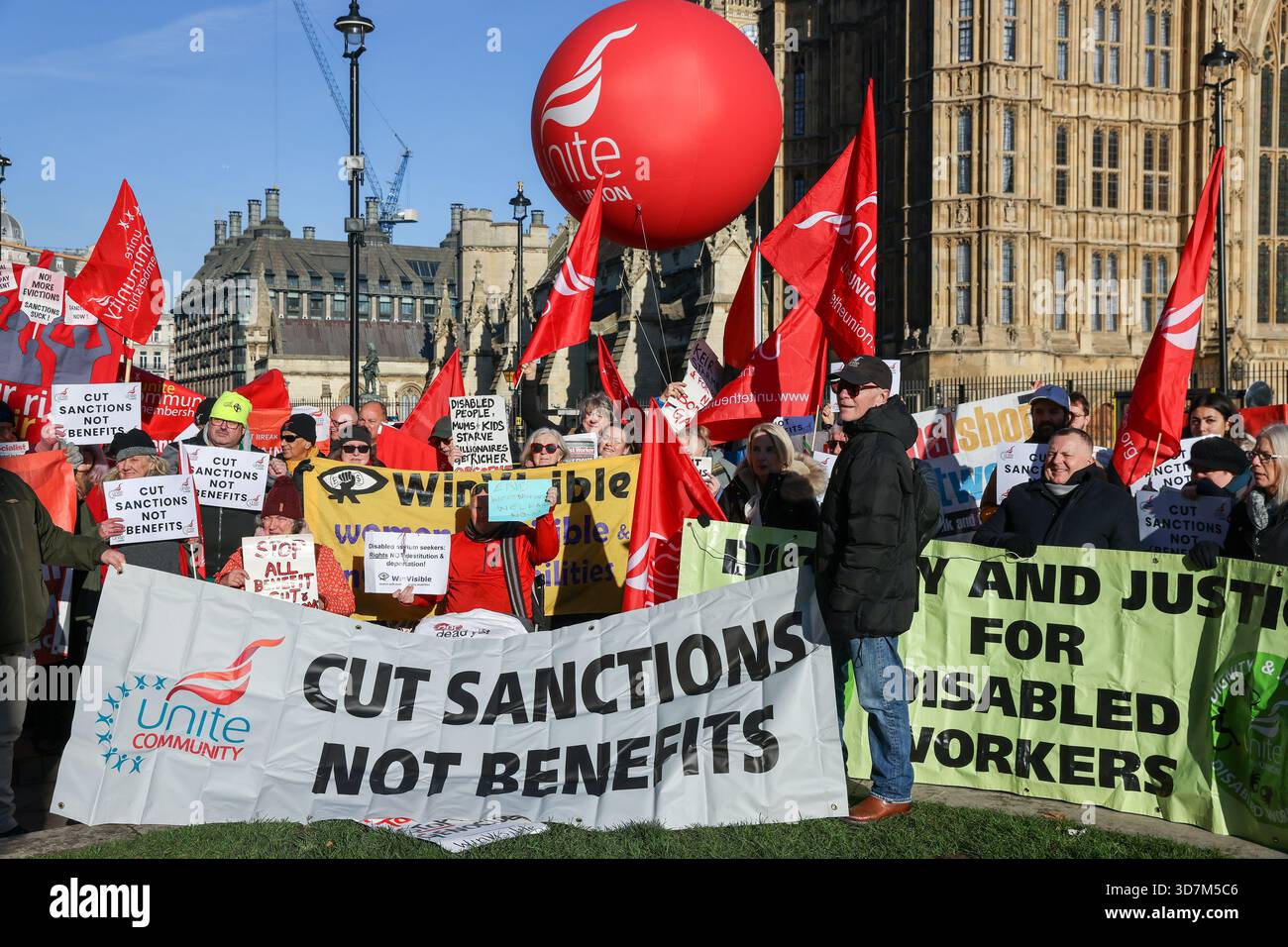 London. UK. 26 Nov 2025. Members of the Unite Union hold signs during a ...