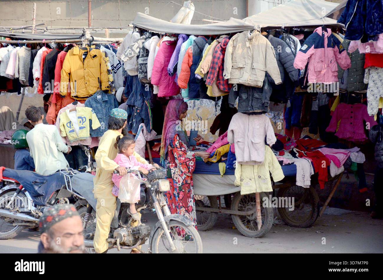 KARACHI, PAKISTAN, NOV 26: Warm clothes are being selling at roadside ...
