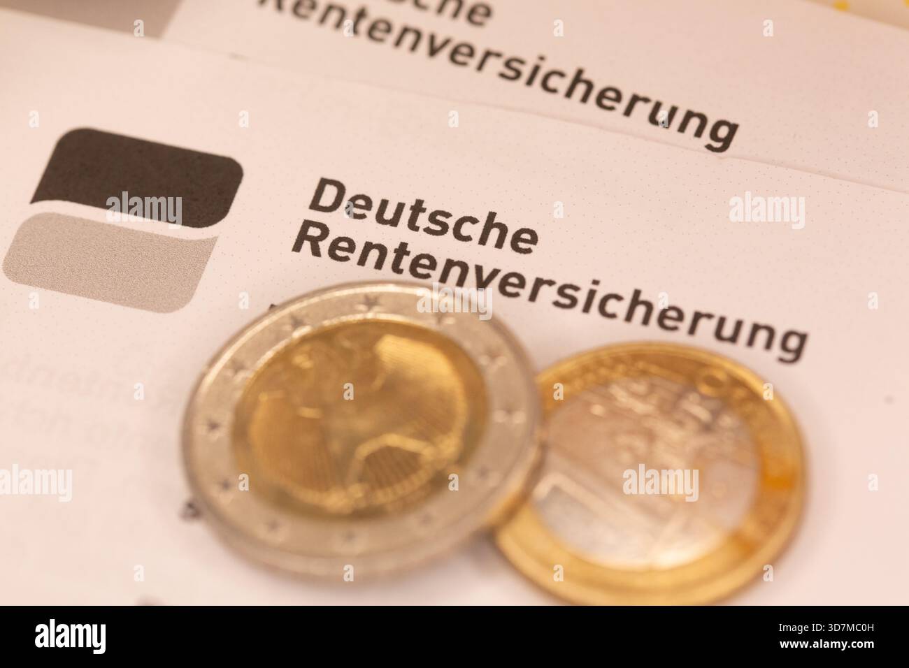 ILLUSTRATION - 26 November 2025, Berlin: Euro coins are on a letter ...