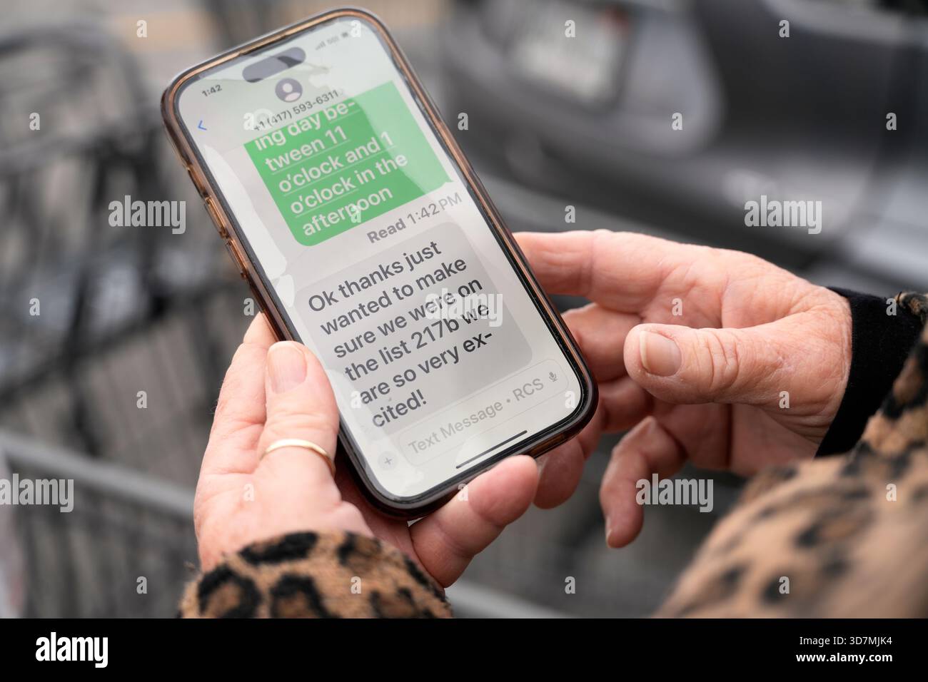 Retired high school cafeteria worker Shirley Mease reads a text from ...