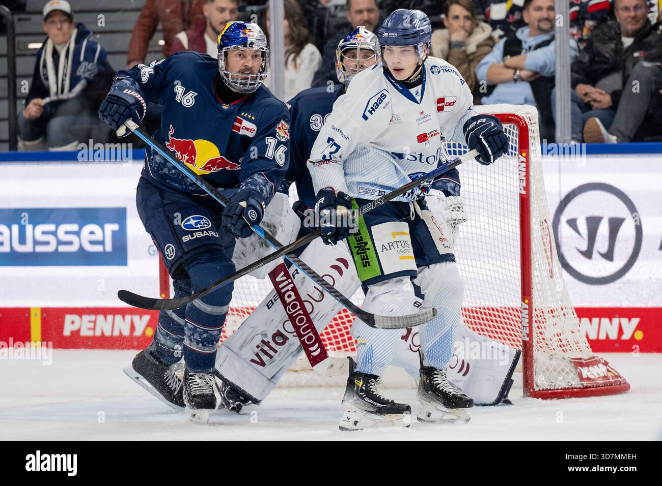 Conrad Abeltshauser (EHC Red Bull Munich, #16) defends against Linus ...