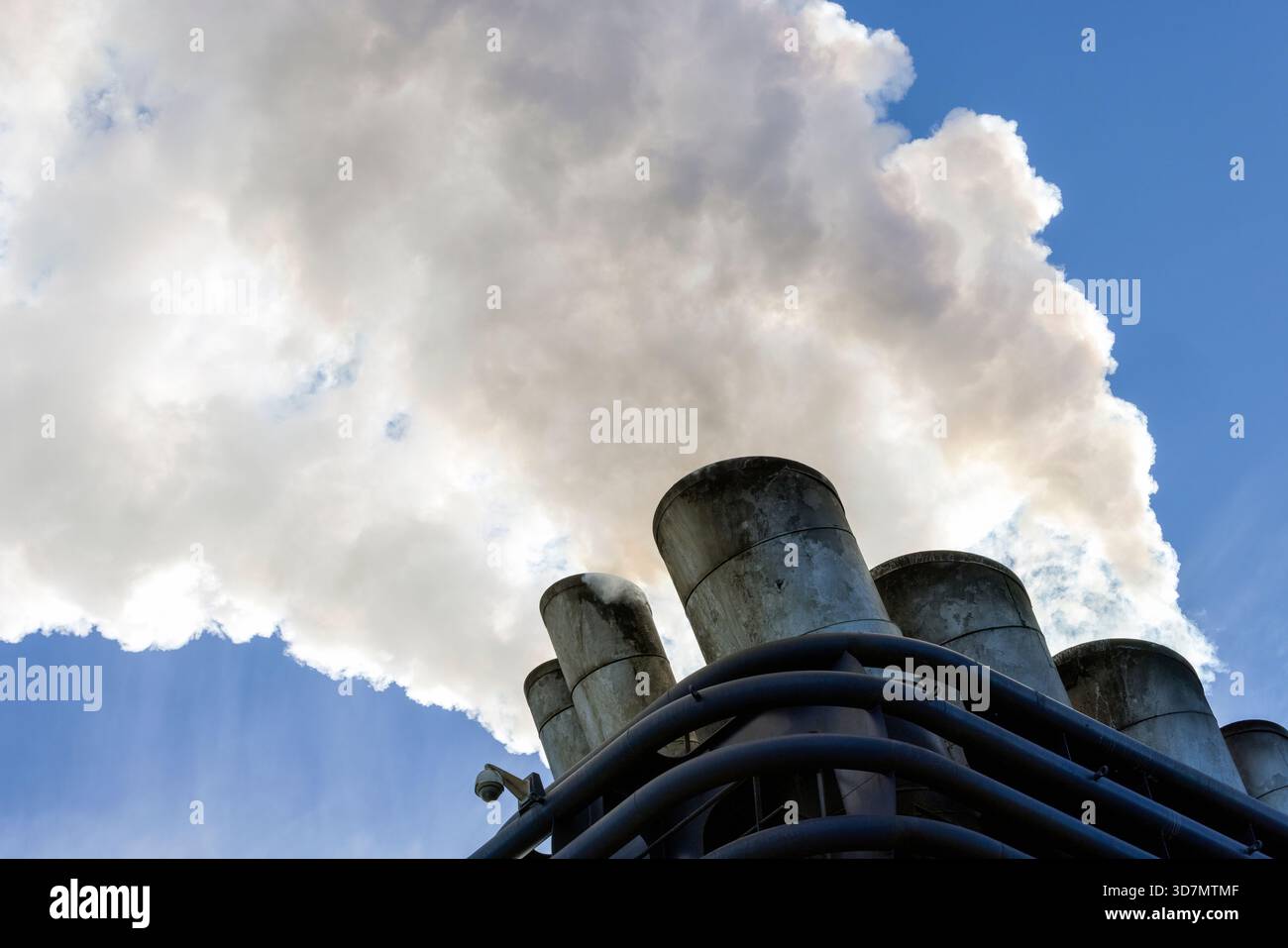 Funnel (smokestack on cruiseship) expelling boiler steam, smoke, and ...