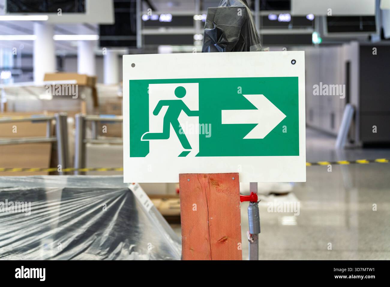 Munich, Bavaria, Germany - November 25, 2025: Escape route sign with ...