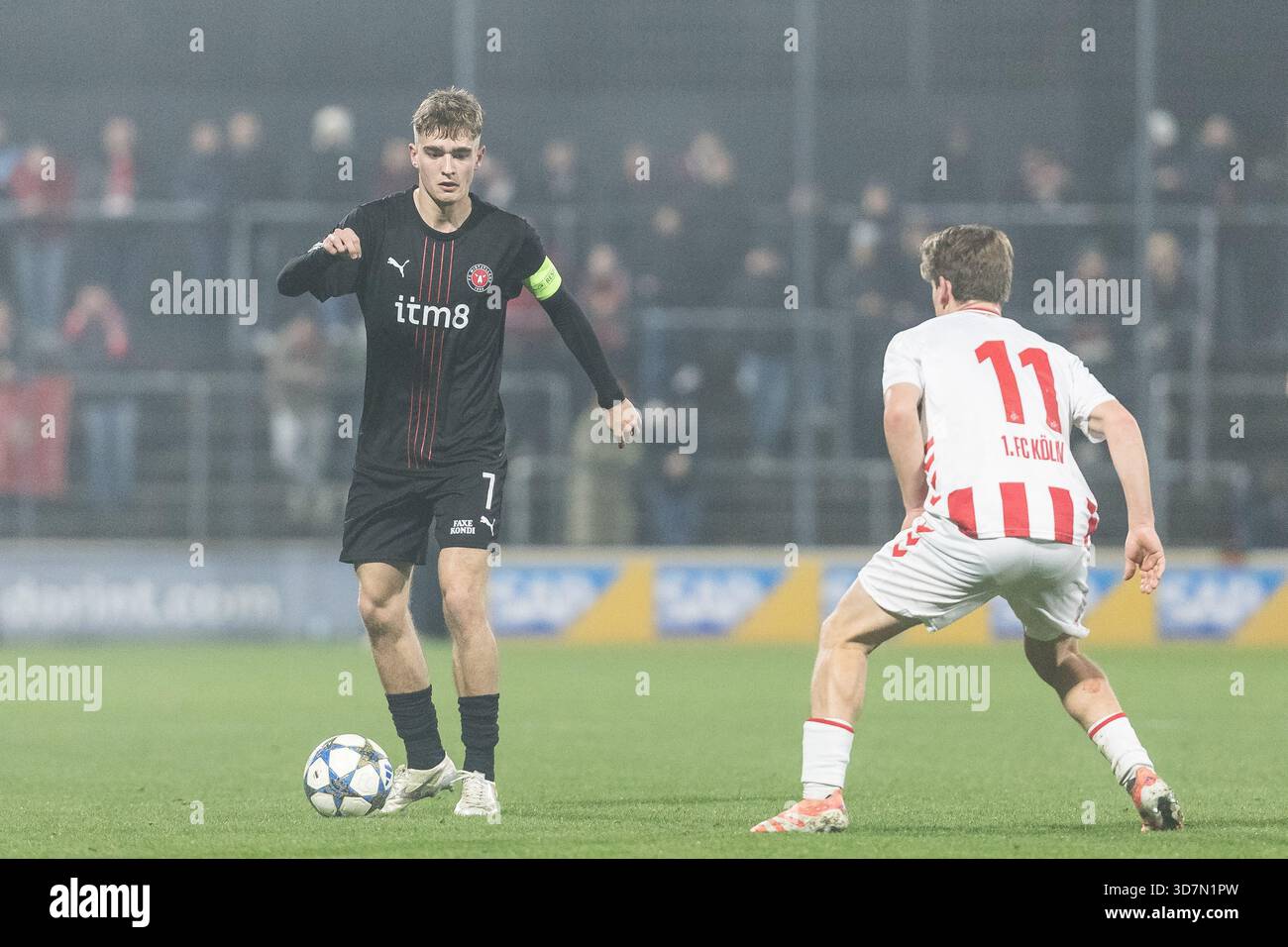 KOELN, GERMANY - NOVEMBER 26: Albert Lodberg (FC Midtjylland, 7) and ...