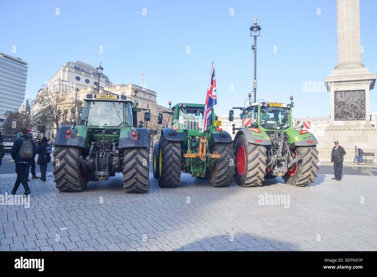 London, UK. 26th November 2025. Tractors are parked in Trafalgar Square ...
