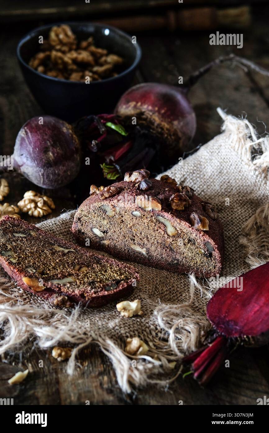 sliced beet rye bread arranged with walnut pieces and fresh beet wedges ...