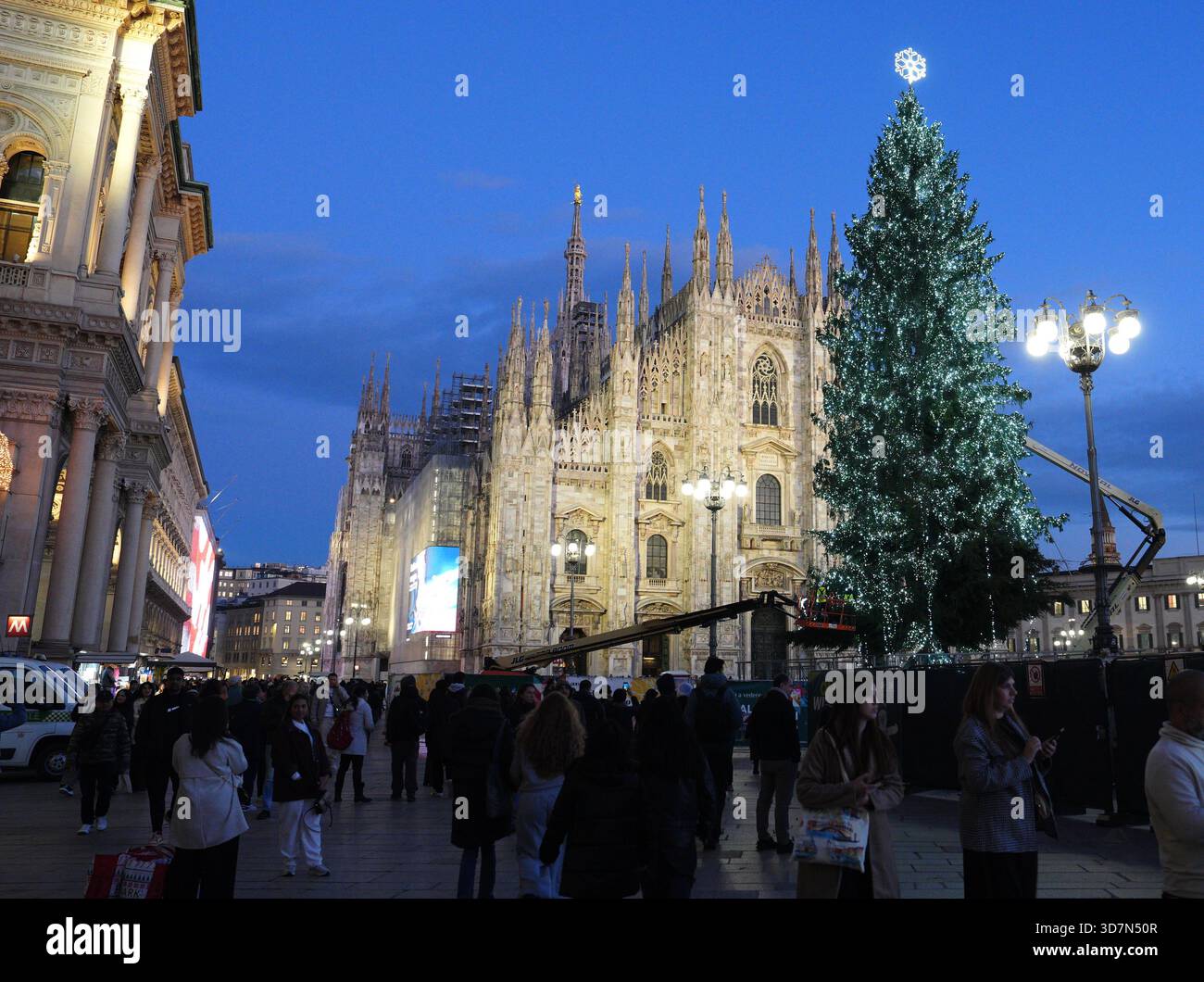 Milan - The Christmas tree in Piazza Duomo is lit up Stock Photo - Alamy