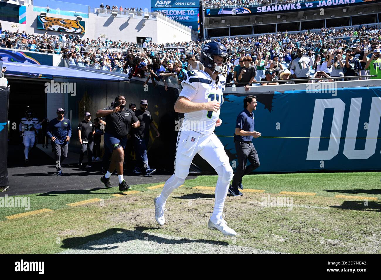 Seattle Seahawks quarterback Sam Darnold (14) heads to the field before ...