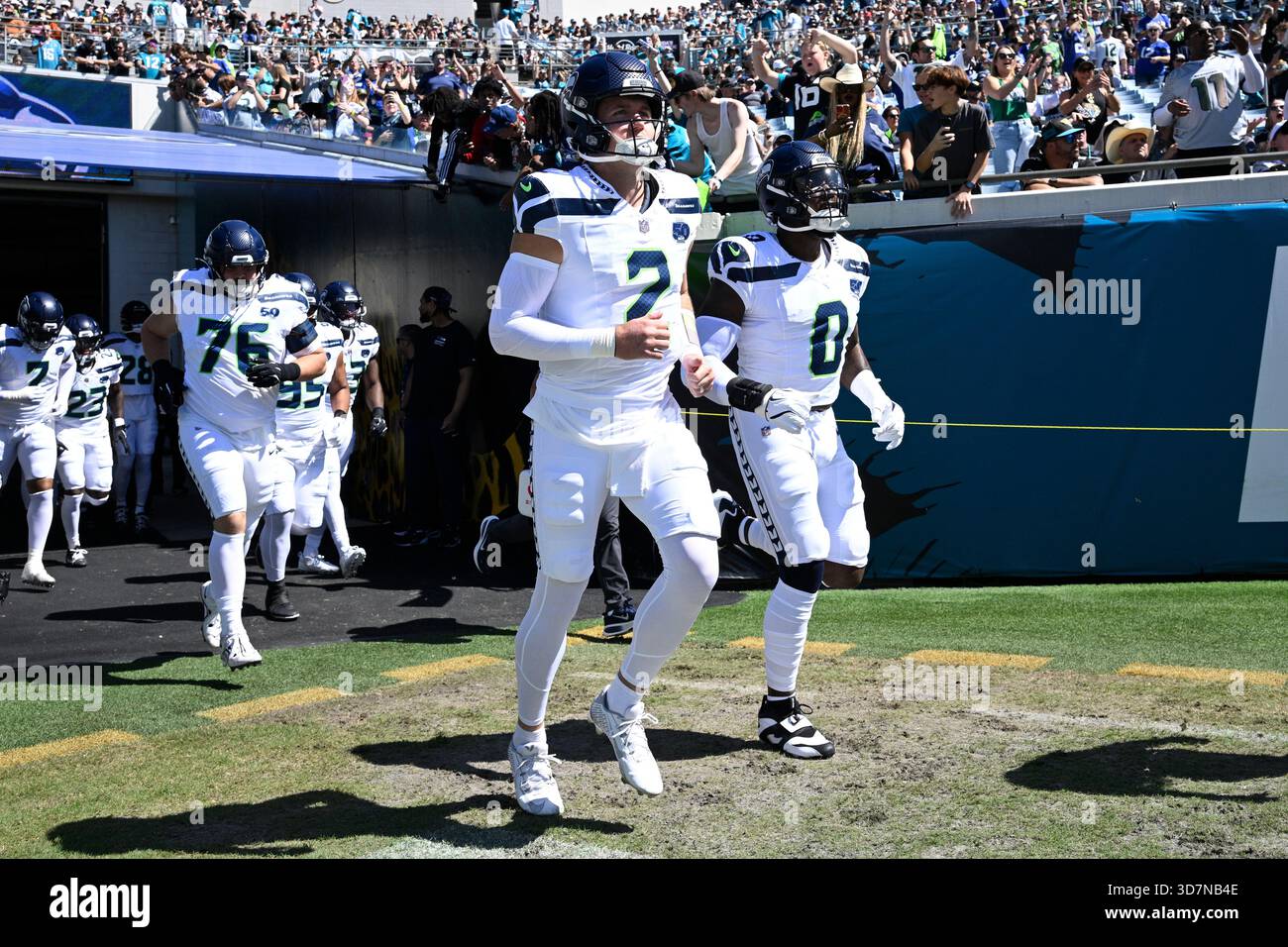 Seattle Seahawks quarterback Drew Lock (2) and linebacker DeMarcus ...