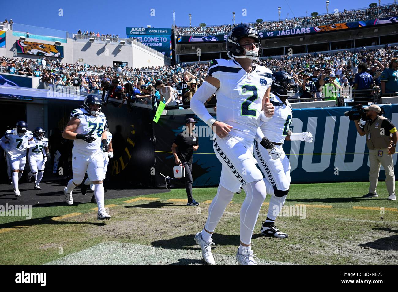 Seattle Seahawks quarterback Drew Lock (2) and linebacker DeMarcus ...