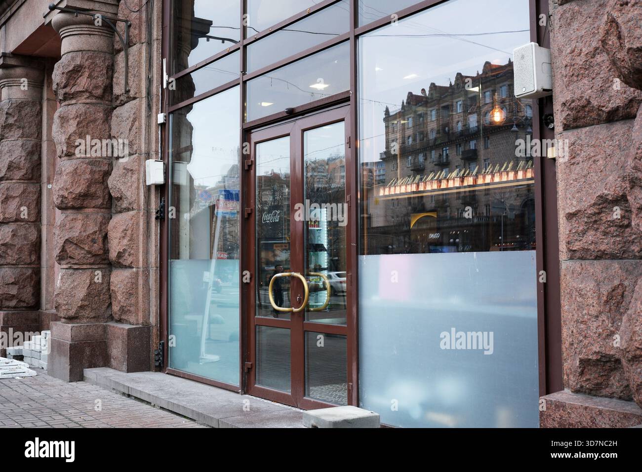 A stylish entrance showcases urban life in a bustling city as the day ...