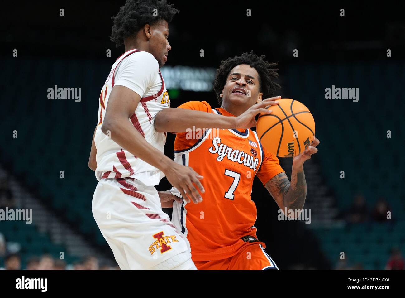 Syracuse forward Kiyan Anthony (7) drives around Iowa State guard ...