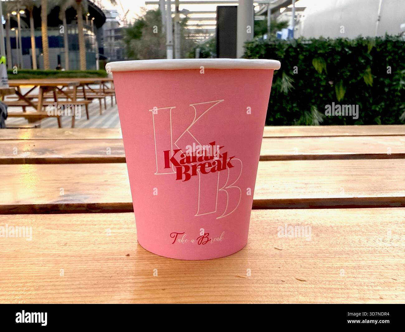 Cup of karak tea on wooden table. A popular street drink in the Persian ...