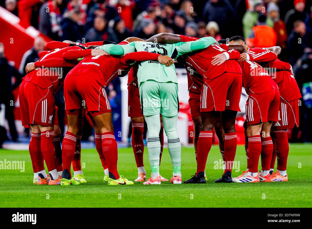 team of Liverpool FC form a huddle during the UEFA Champions League ...