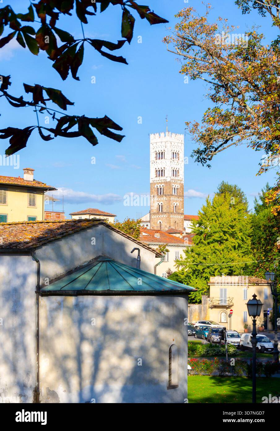 Charming view of a historic bell tower rising above traditional houses ...