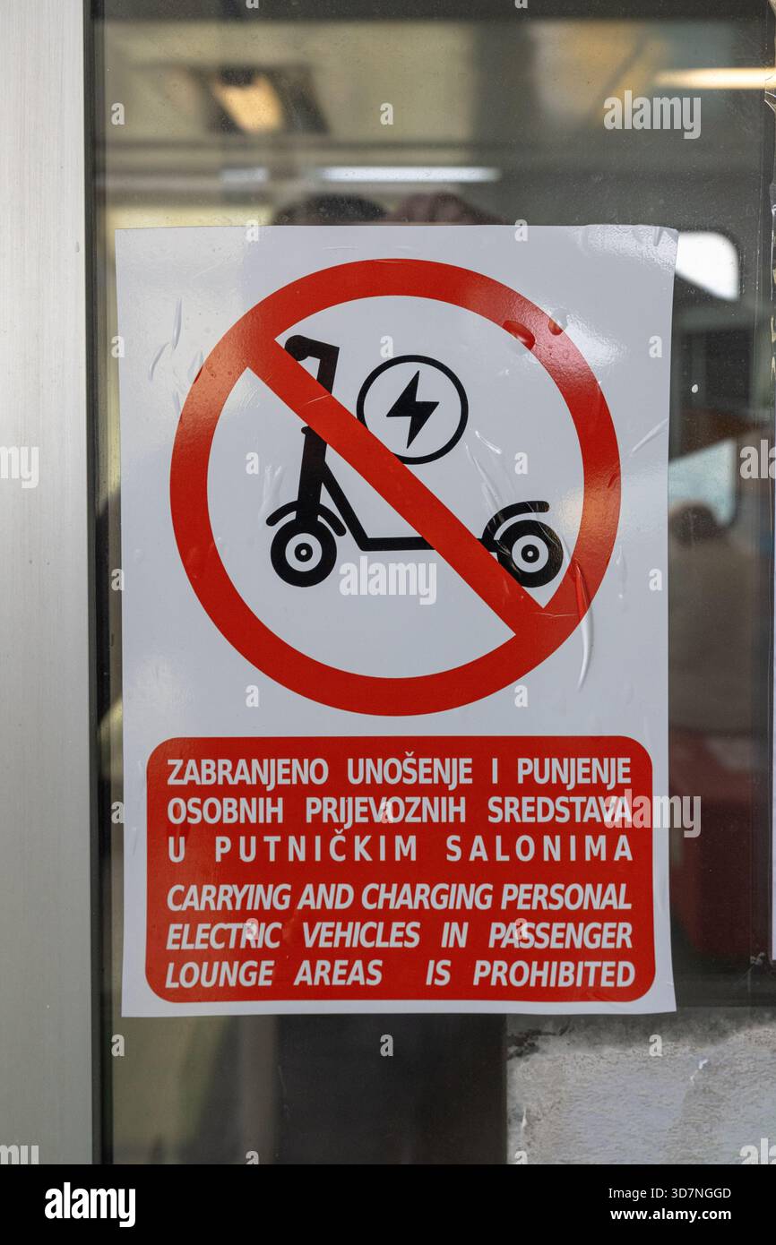 A bold red prohibition sign overlays a scooter symbol, informing that ...