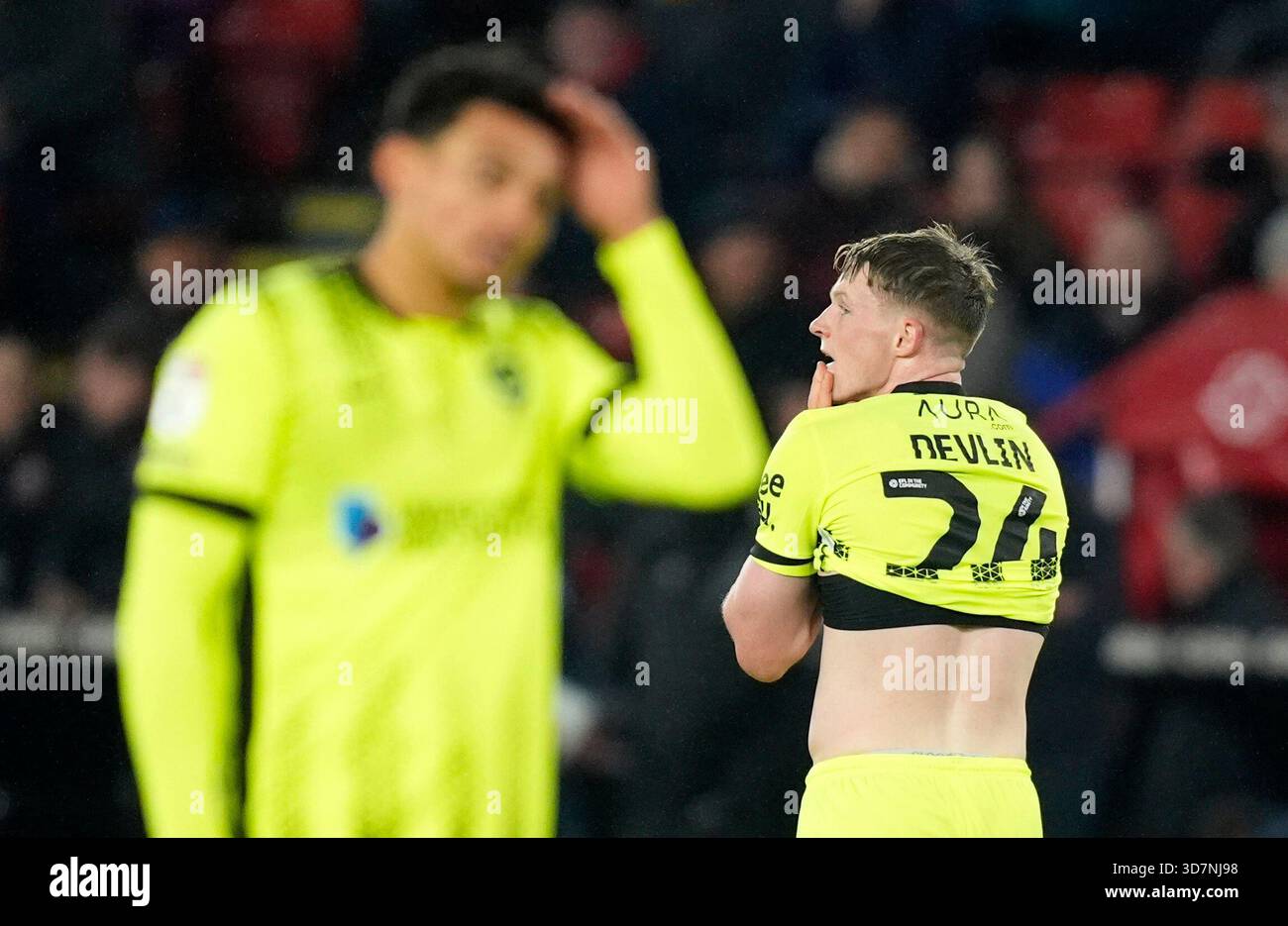 Portsmouth's Terry Devlin (right) leaves the pitch after being shown a ...