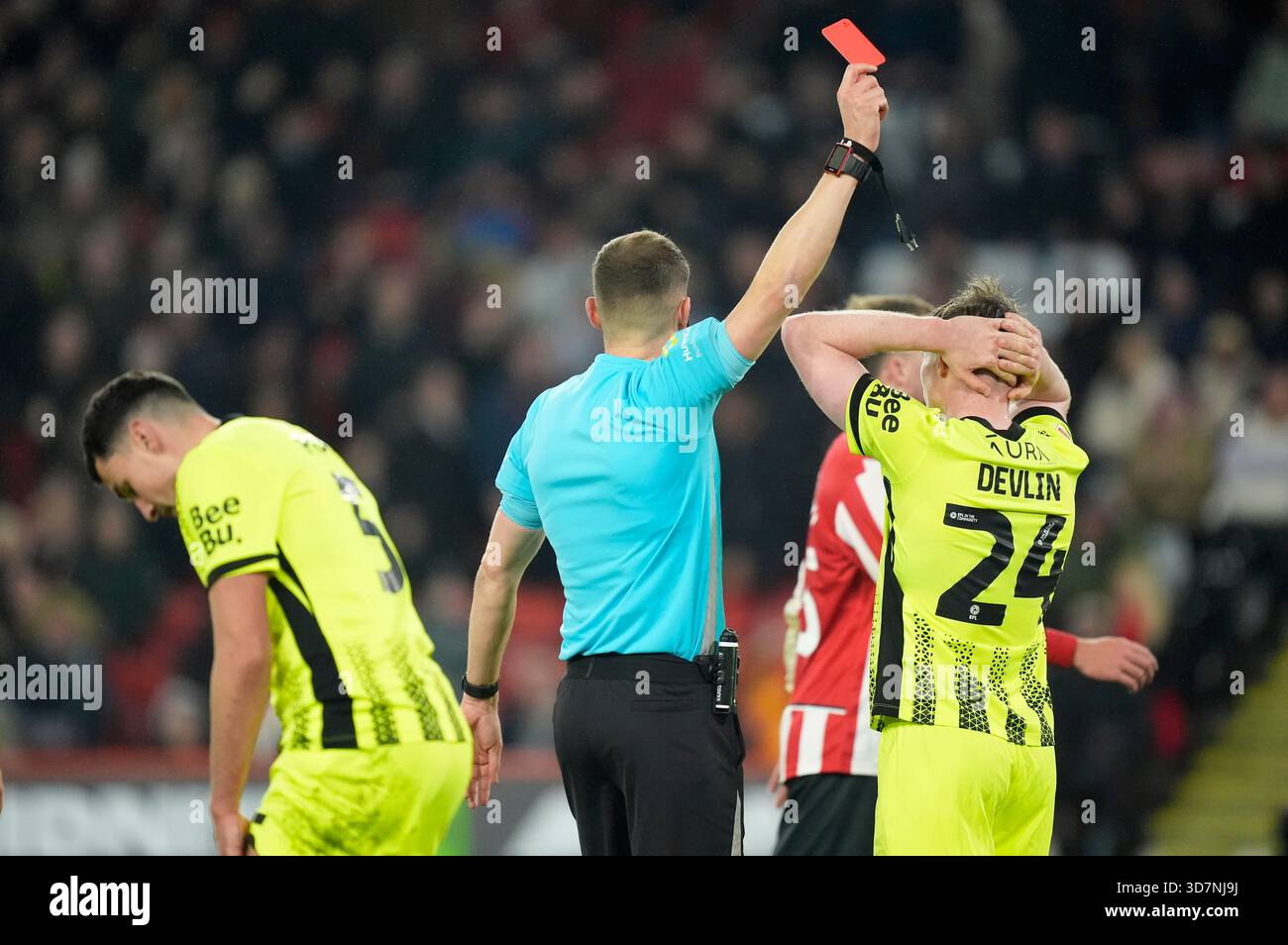 Referee Leigh Doughty shows a red card to Portsmouth's Terry Devlin (right) as he awards a ...