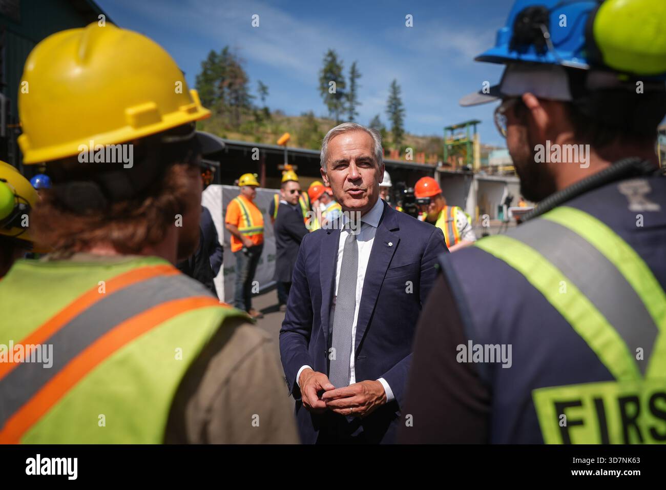 Prime Minister Mark Carney greets employees after touring the Gorman ...