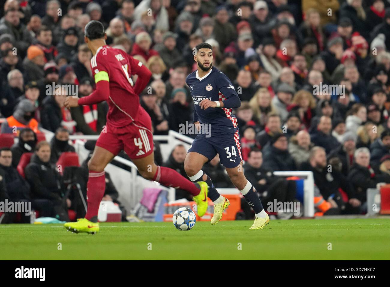 PSV's Ismael Saibari, right, and Liverpool's Virgil van Dijk challenge ...
