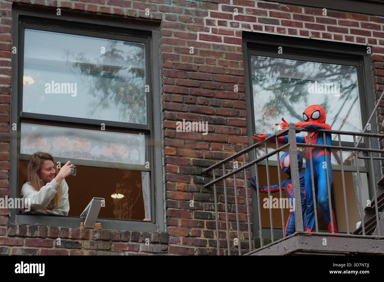 A young Spider-Man fan shows off his costume during the balloon ...