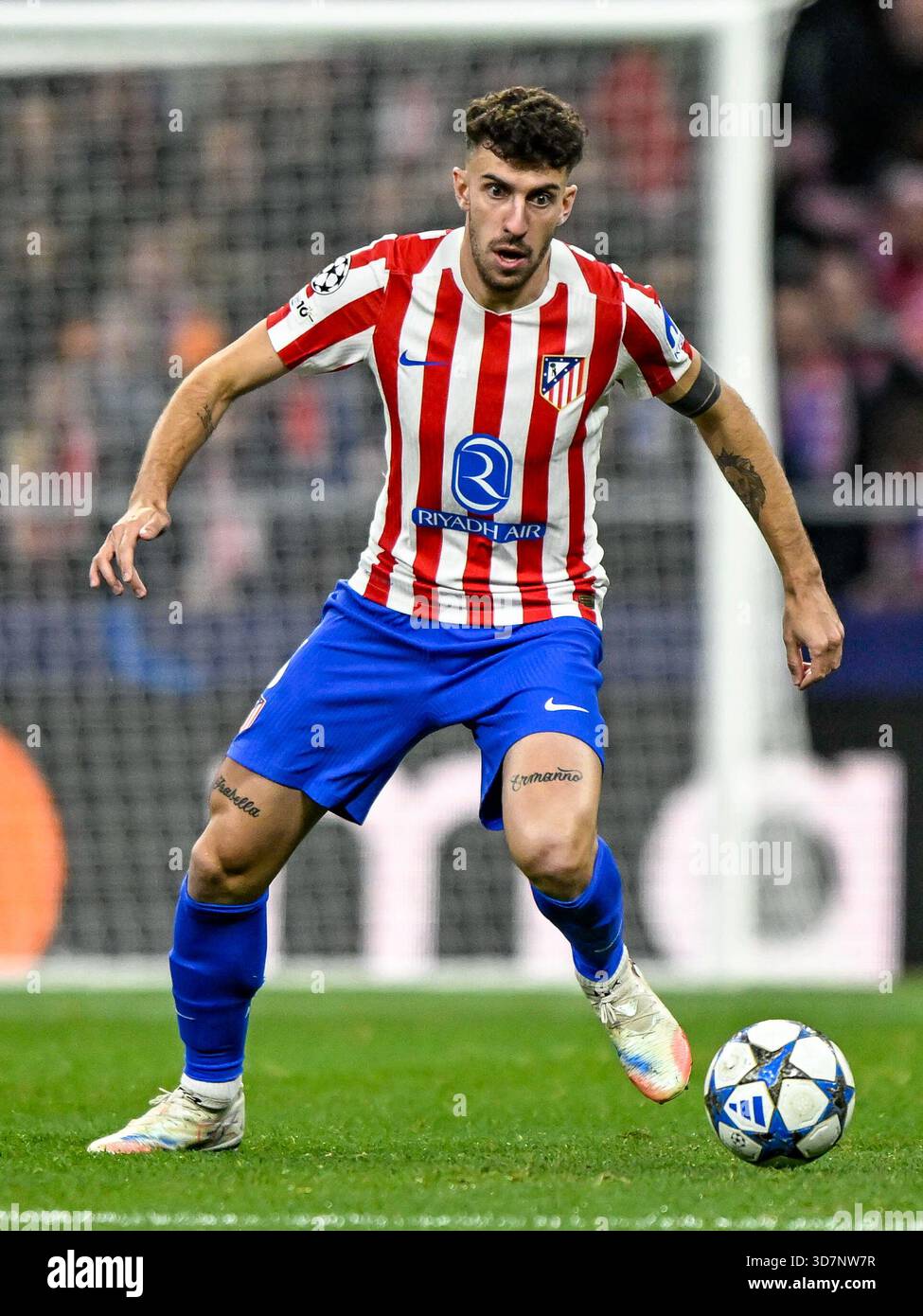 MADRID, SPAIN - NOVEMBER 26: Matteo Ruggeri of Atletico de Madrid runs ...
