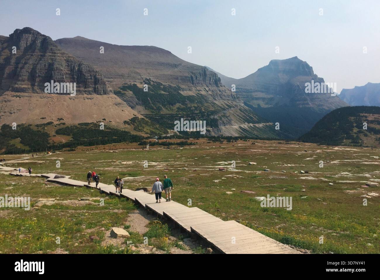 File - People hike at Glacier National Park in Montana. (AP Photo/Beth ...