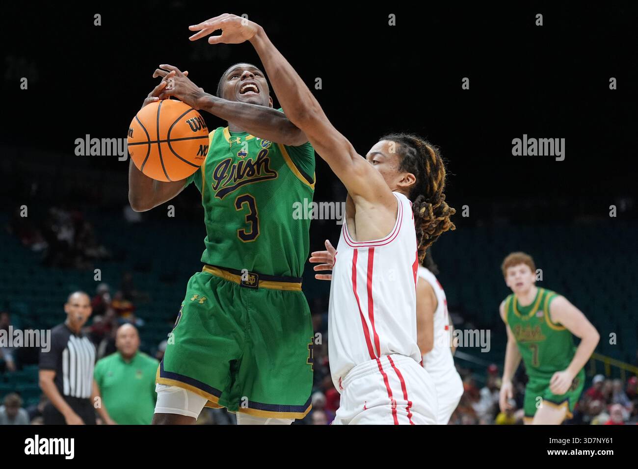 Notre Dame guard Markus Burton (3) is blocked by Houston guard Kingston ...