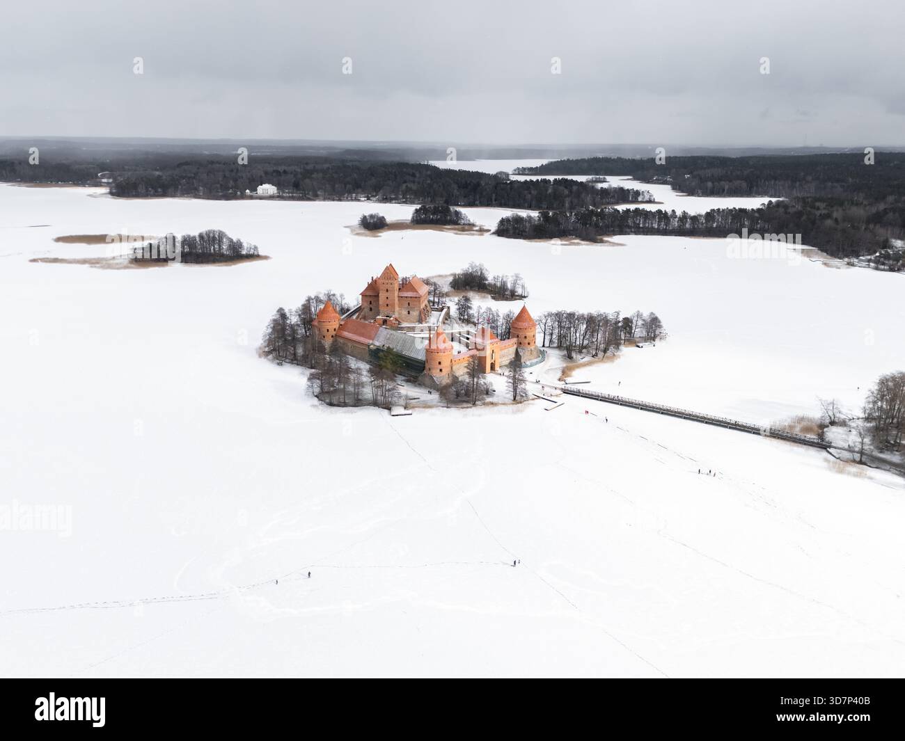 Aerial view of Trakai Island Castle stands resilient amidst the stark ...