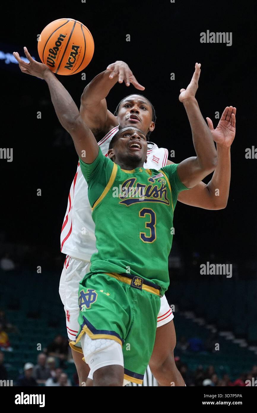Notre Dame guard Markus Burton (3) Houston guard Mercy Miller (25 ...
