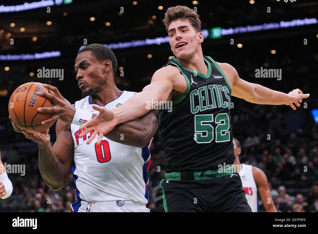 Boston Celtics center Luka Garza (52) tries to steal the ball from ...