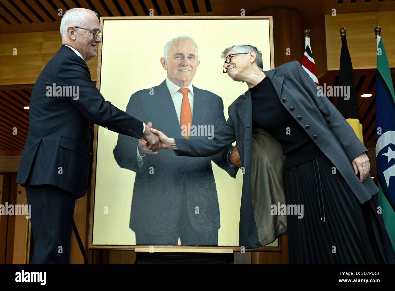 Former Australian Prime Minister Malcolm Turnbull and artist Jude Rae unveil his official ...