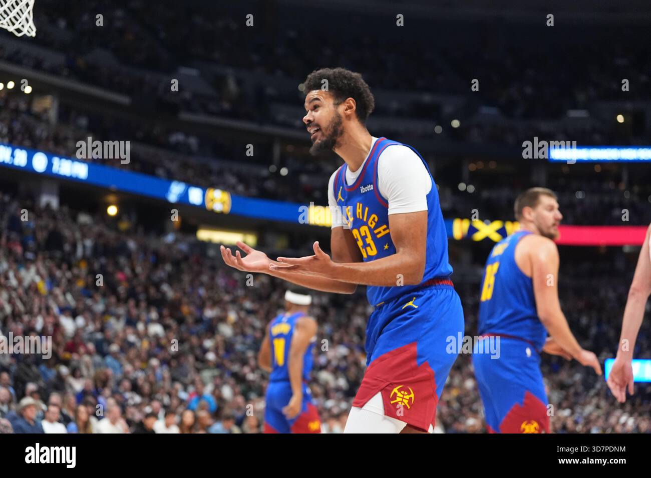 Denver Nuggets forward Cameron Johnson (23) argues after called for a ...