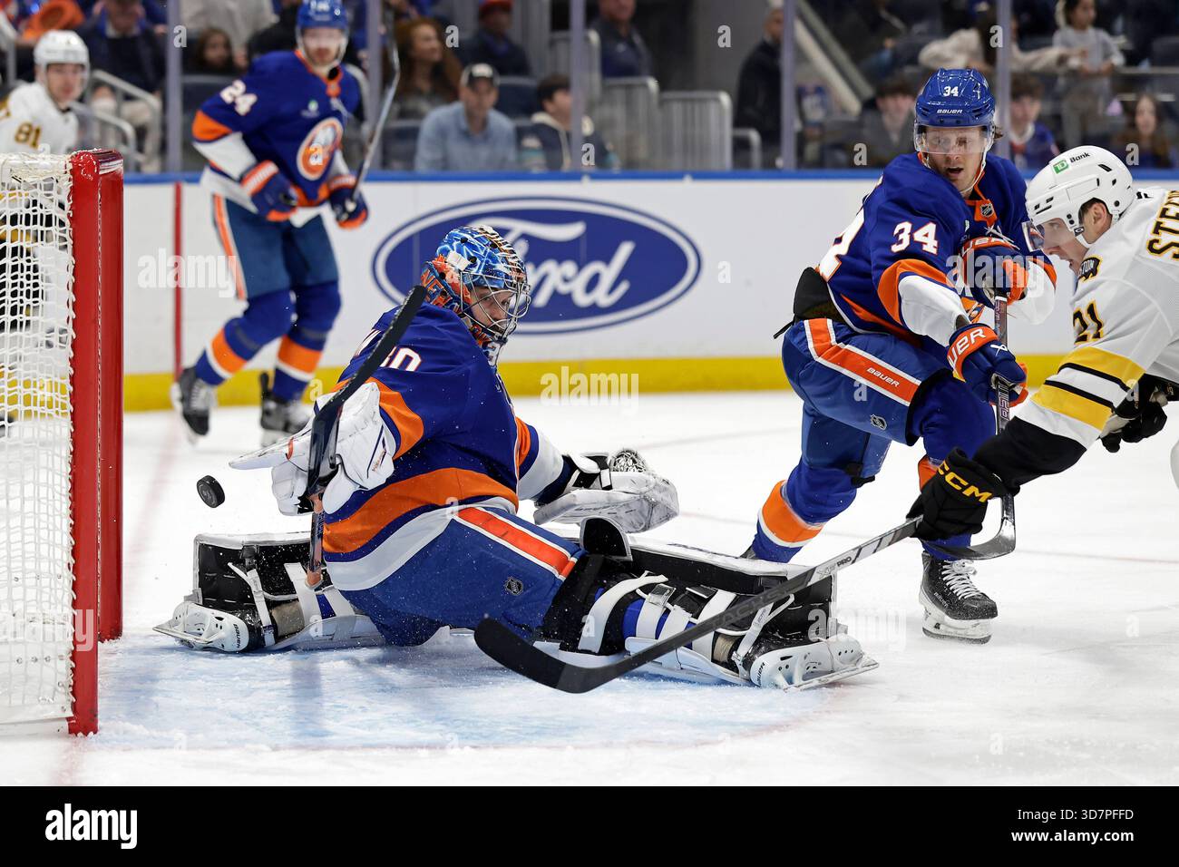 Boston Bruins center Alex Steeves, right, scores a goal past New York ...