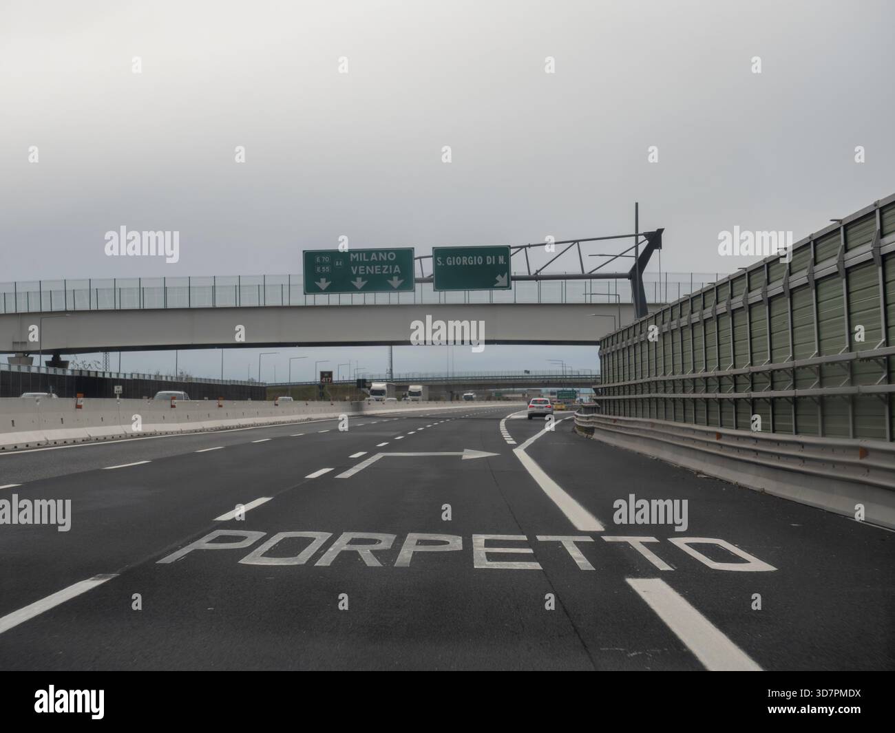 A highway with overhead road signs and an overpass, November 21st 2025 ...