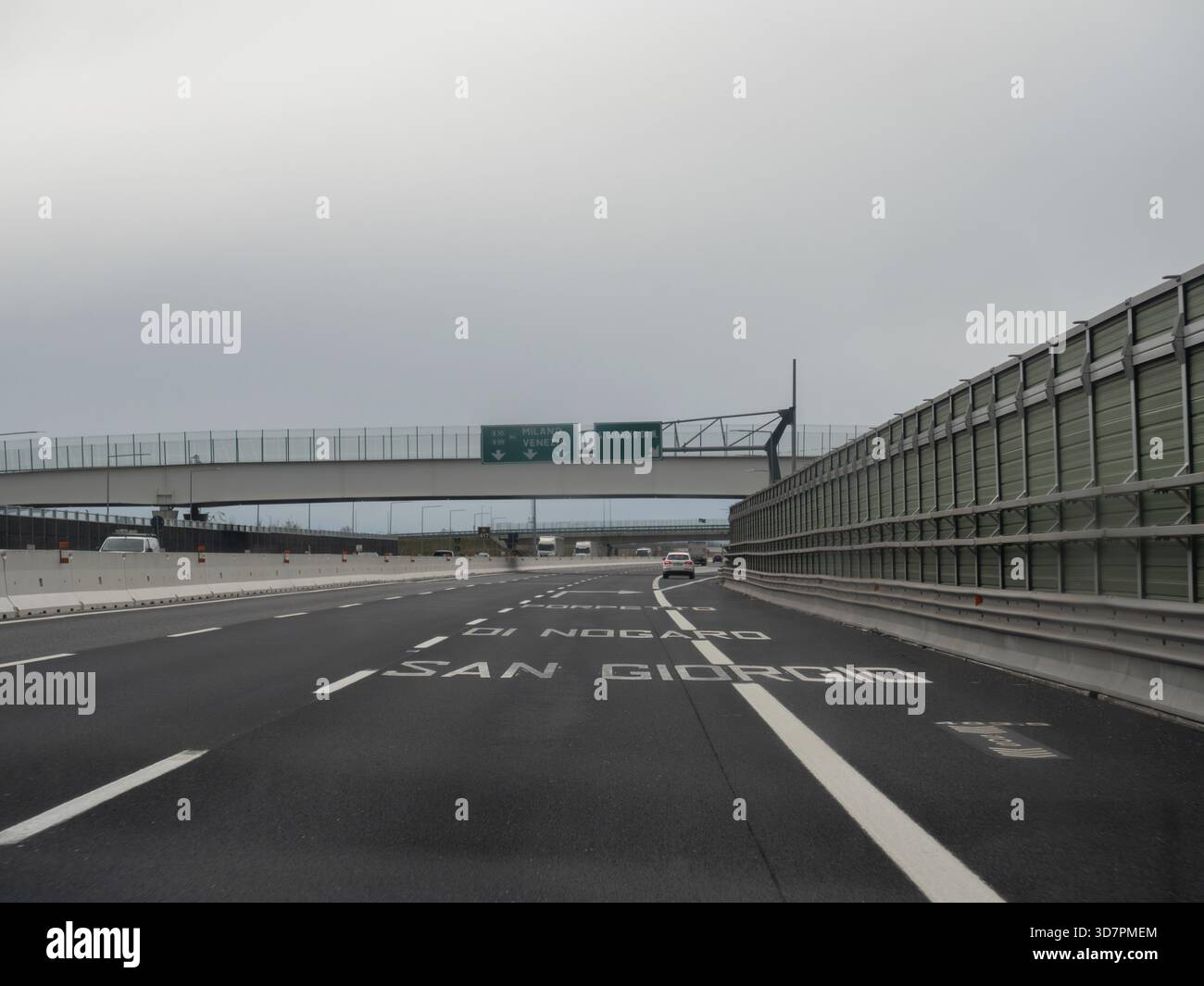 A deserted highway with road signs and an overpass, November 21st 2025 ...