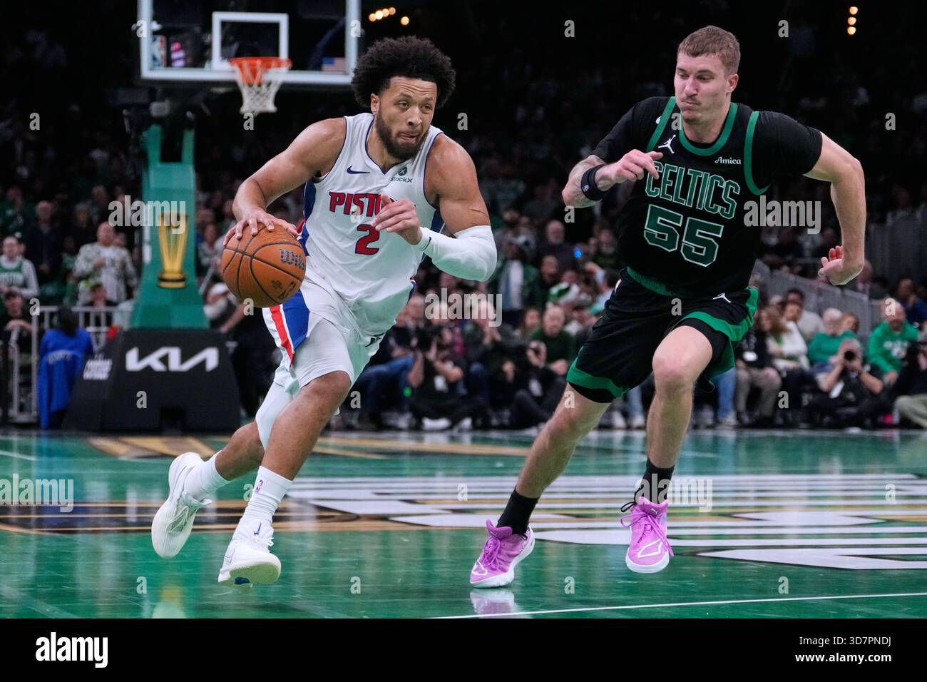 Detroit Pistons guard Cade Cunningham (2) drives past Boston Celtics guard Baylor Scheierman (55 ...