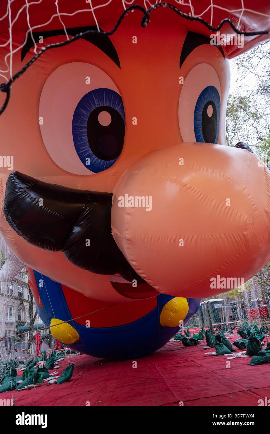 New to the parade this year, the Mario balloon is seen inflated and ...