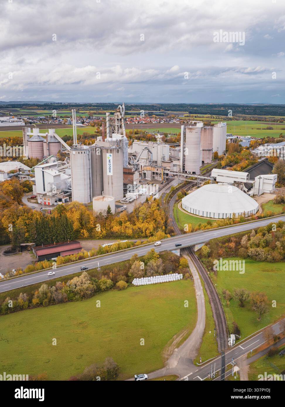 A view from above of an extensive industrial complex in the midst of an ...