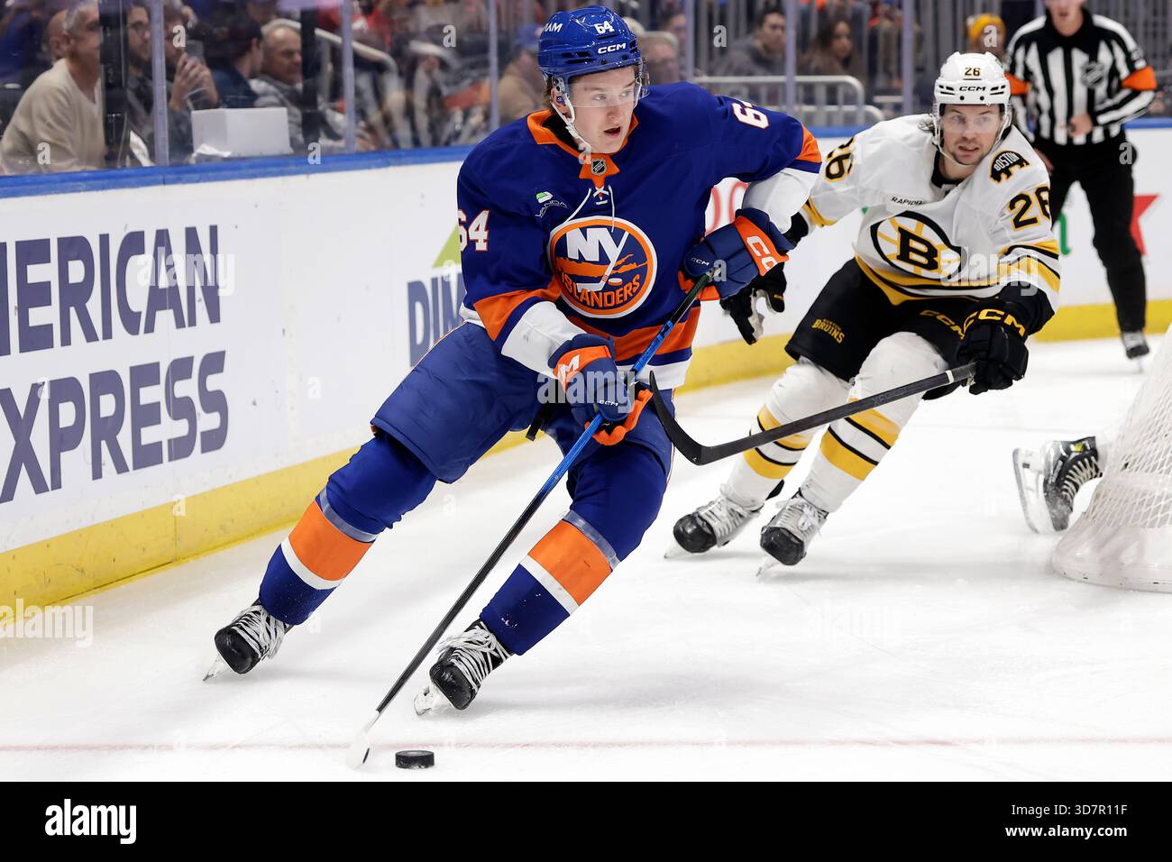 New York Islanders center Calum Ritchie (64) controls the puck past ...