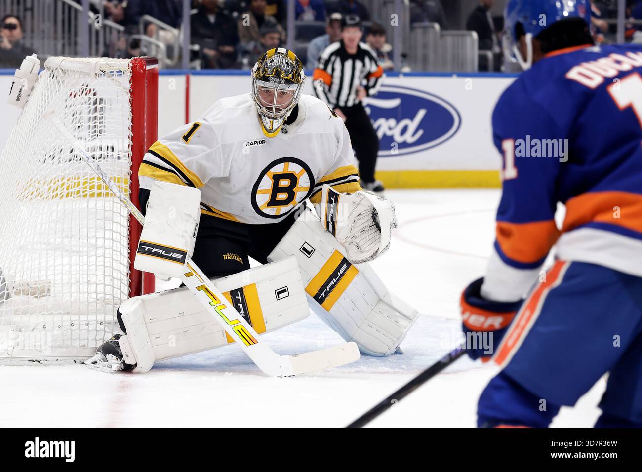 Boston Bruins goaltender Jeremy Swayman (1) defends his net in the ...