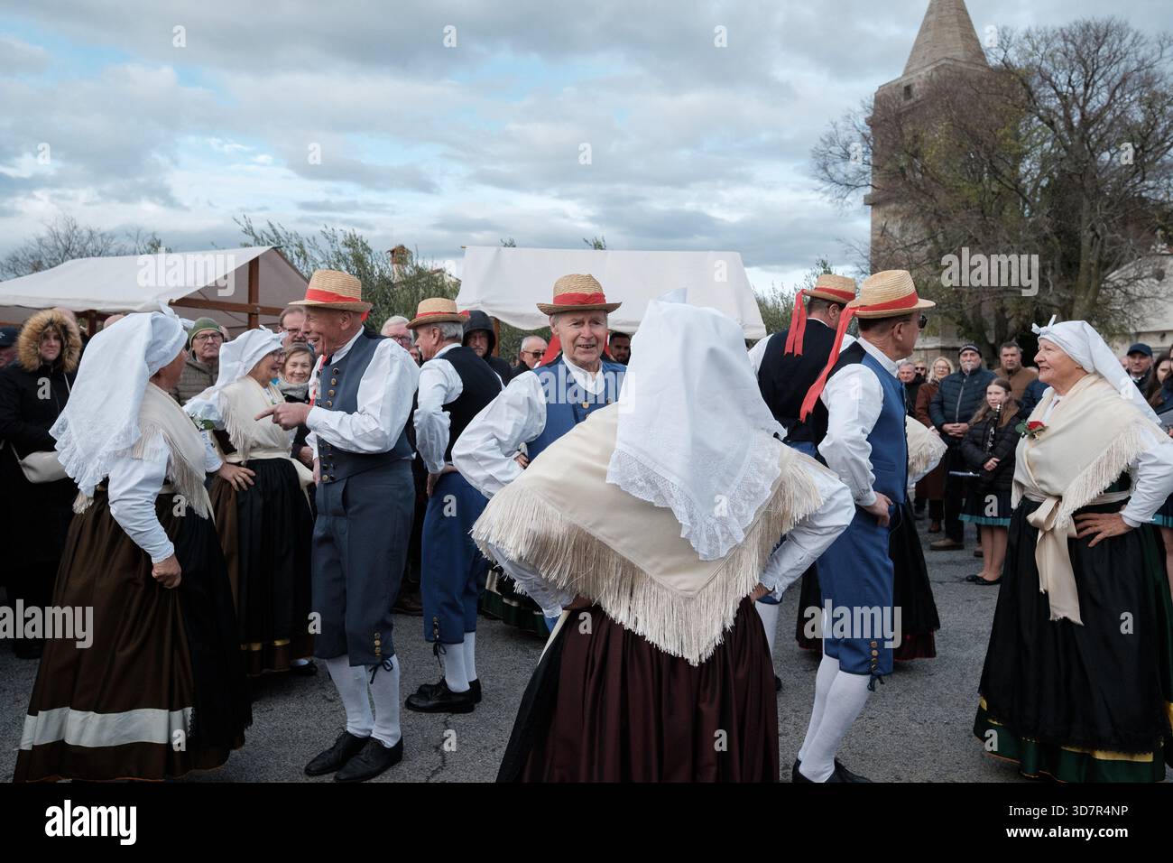 A folklore group performs during the opening of the world's first olive ...