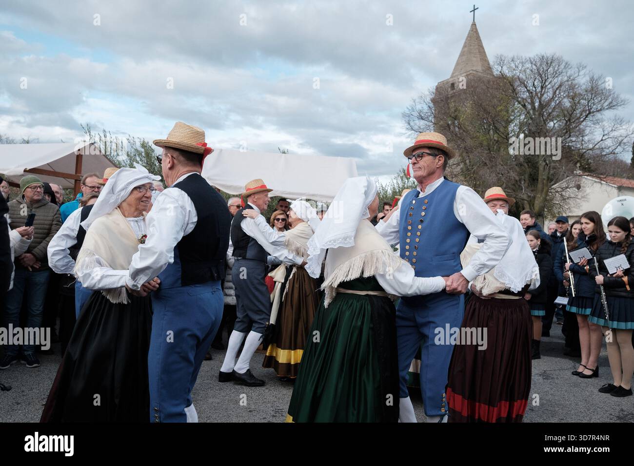 A folklore group performs during the opening of the world's first olive ...