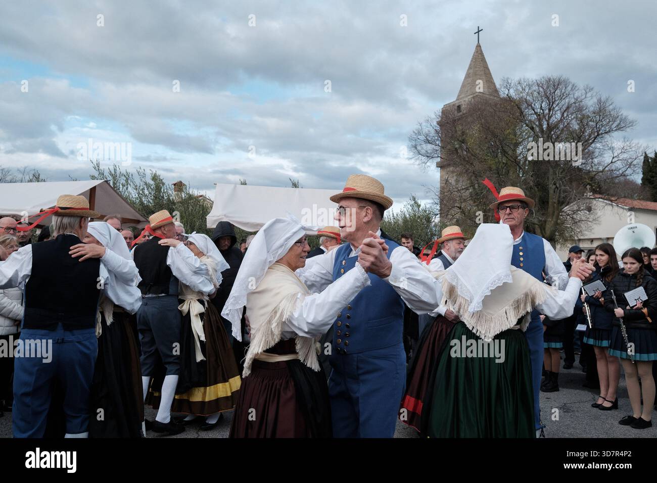 A folklore group performs during the opening of the world's first olive ...