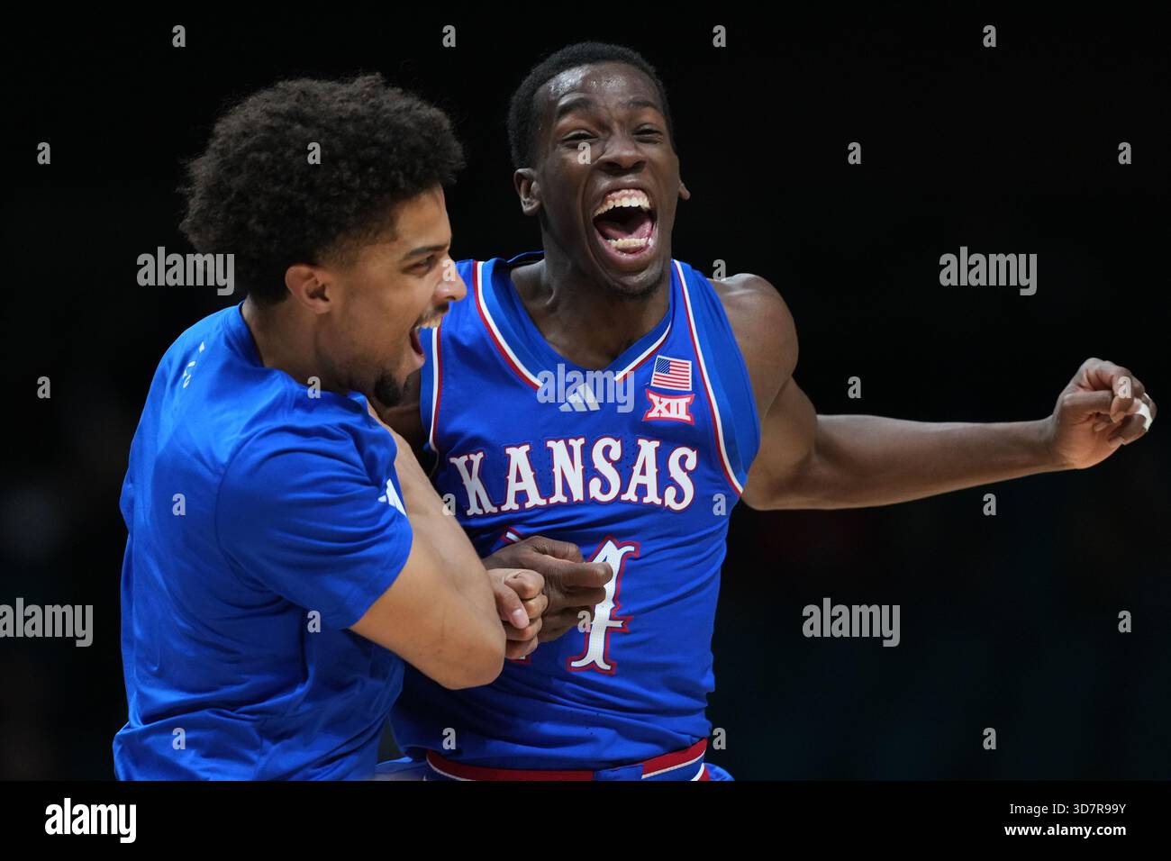 Kansas guard Melvin Council Jr., right, celebrates with teammate Justin ...