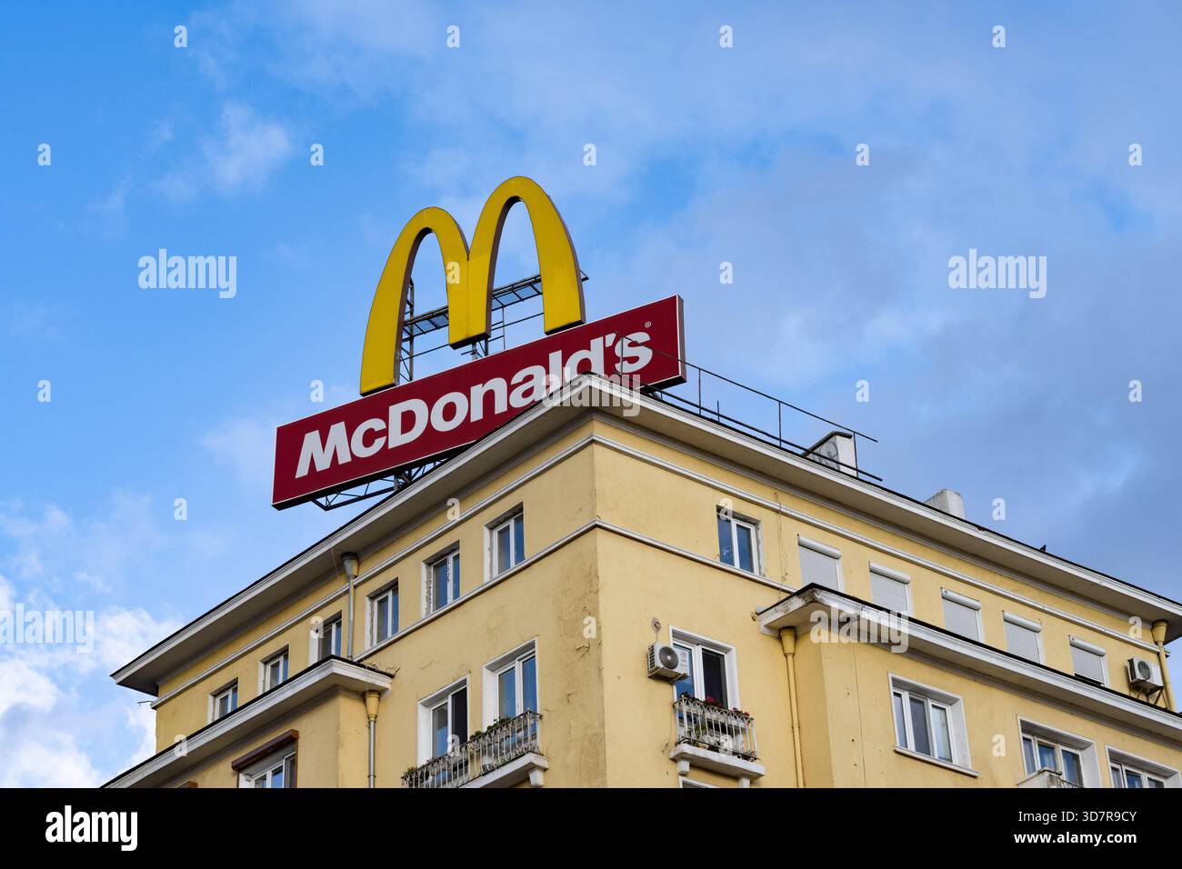 World famous brand logo sign for McDonald’s fast food chain seen on a ...